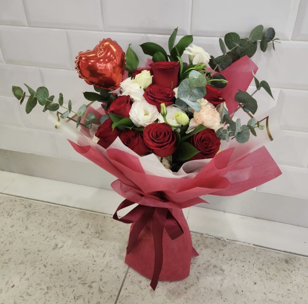 Beautiful 9 red roses in a bouquet with one mini 4 inch red heart ...